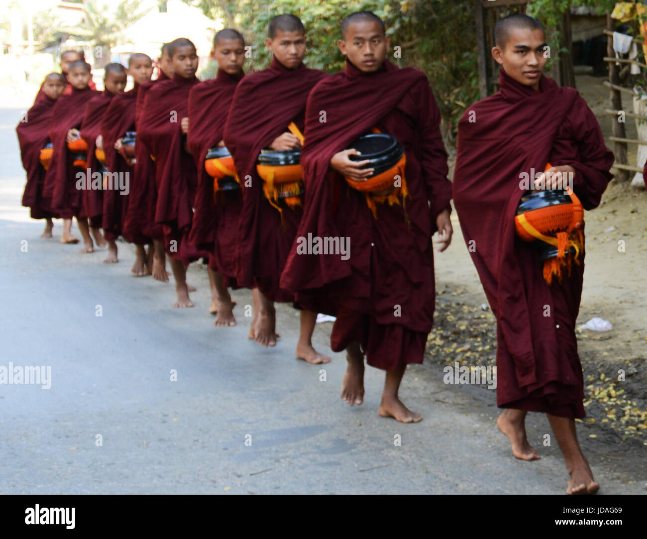 Burmese monks collecting alms Stock Photo - Alamy