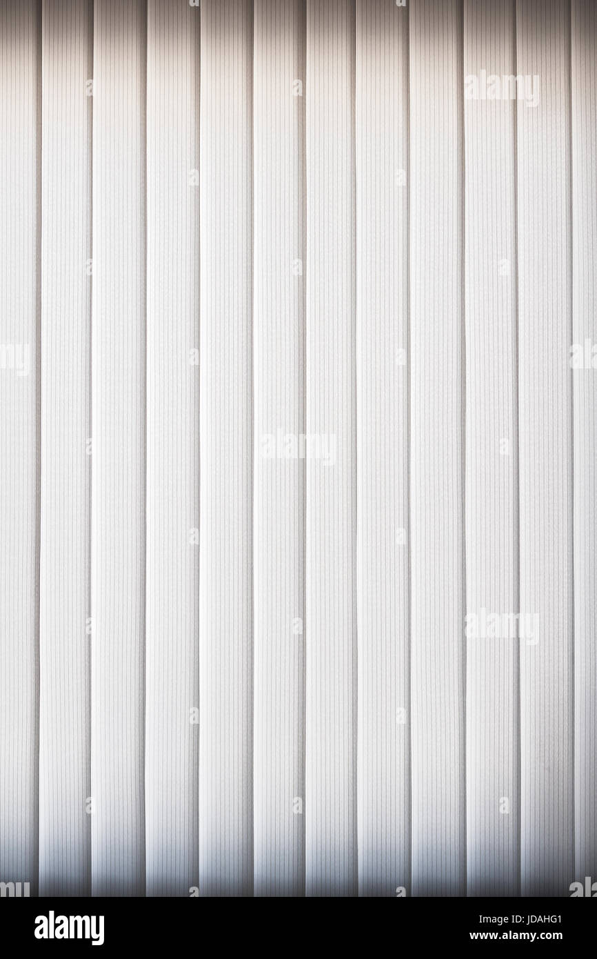 White vertical blinds closeup for the background Stock Photo - Alamy