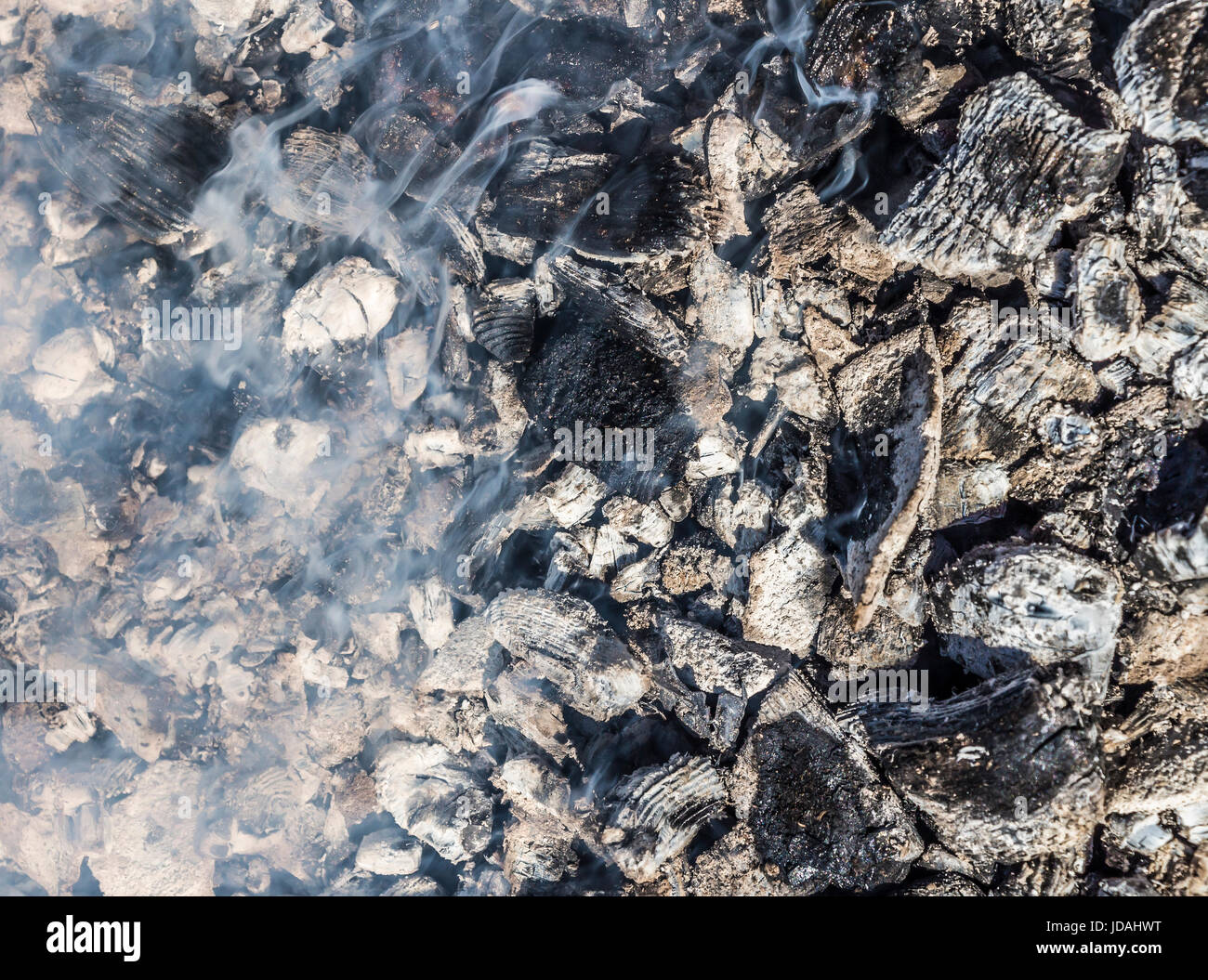Smoldering embers and fuming close up as a the background Stock Photo ...