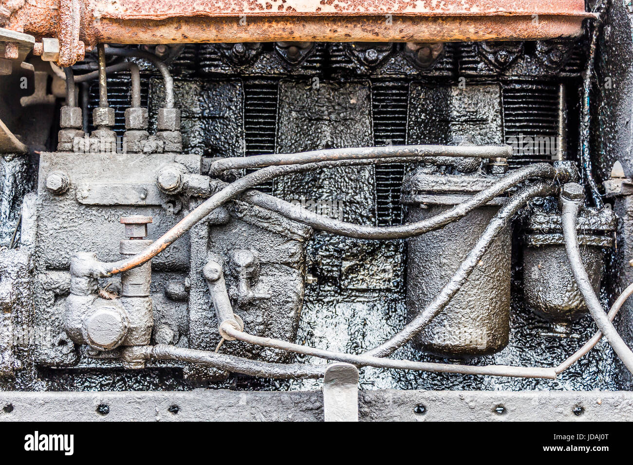 Old, very dirty, rusty diesel engine closeup Stock Photo - Alamy