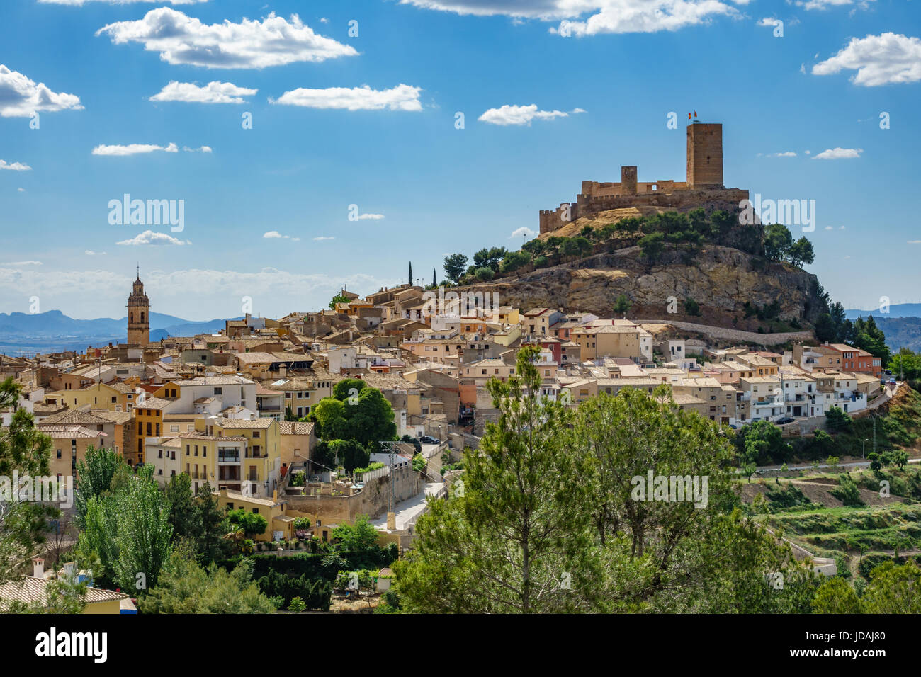 Top of the hill with Biar castle and town at dusk in Alicante, Spain ...
