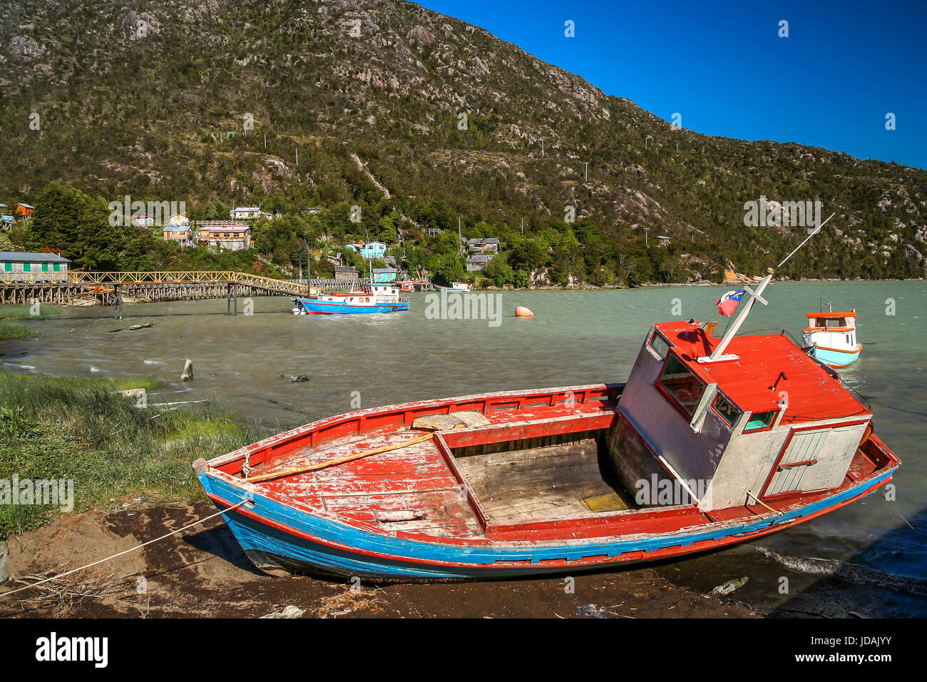 Disused fishing boat on the riverbank in Patagonian Andes Stock Photo ...