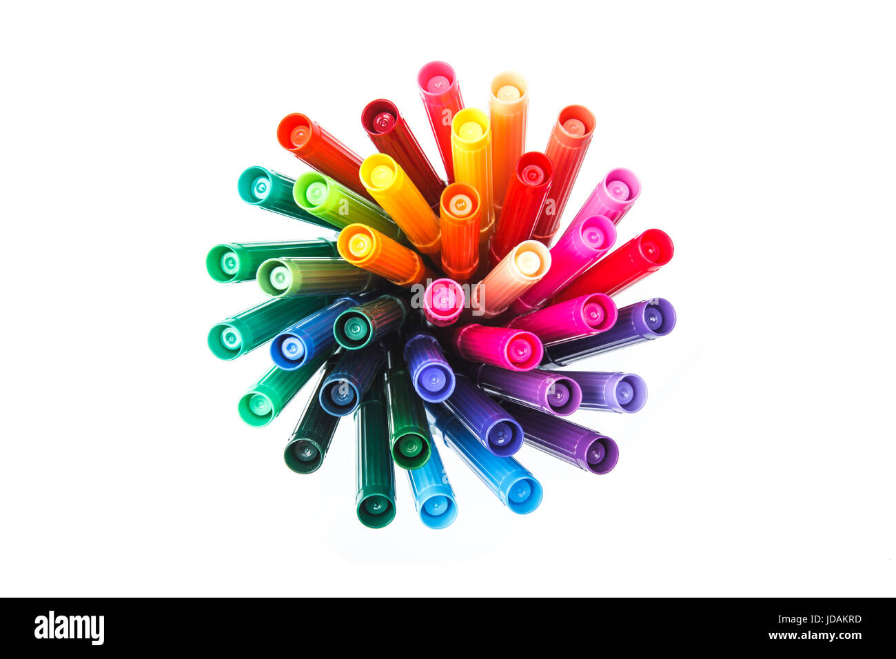 Set of markers in a paper cup and a piece of paper on white background ...