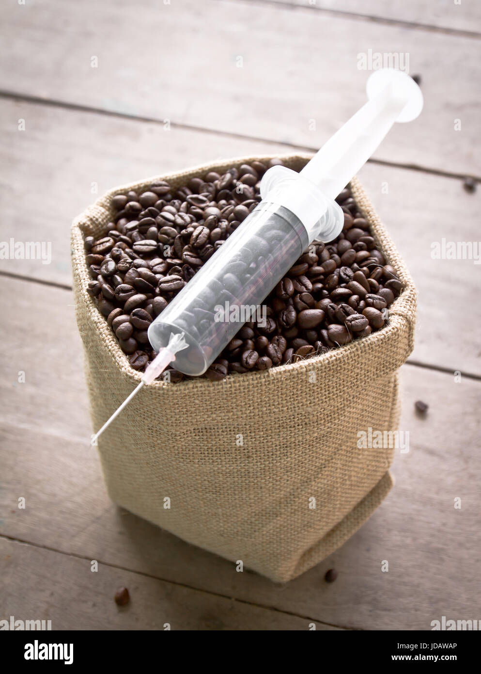 coffee bean and syringe, it's mean to addictive Stock Photo - Alamy