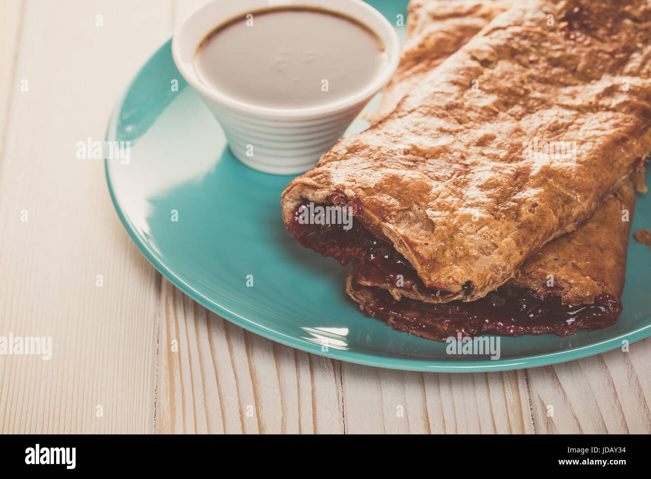 Baking, cherry strudel in a plate on wooden white background Stock ...