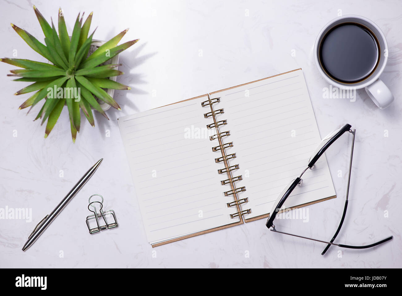 Flat lay, top view of open notebook and other supplies Stock Photo - Alamy