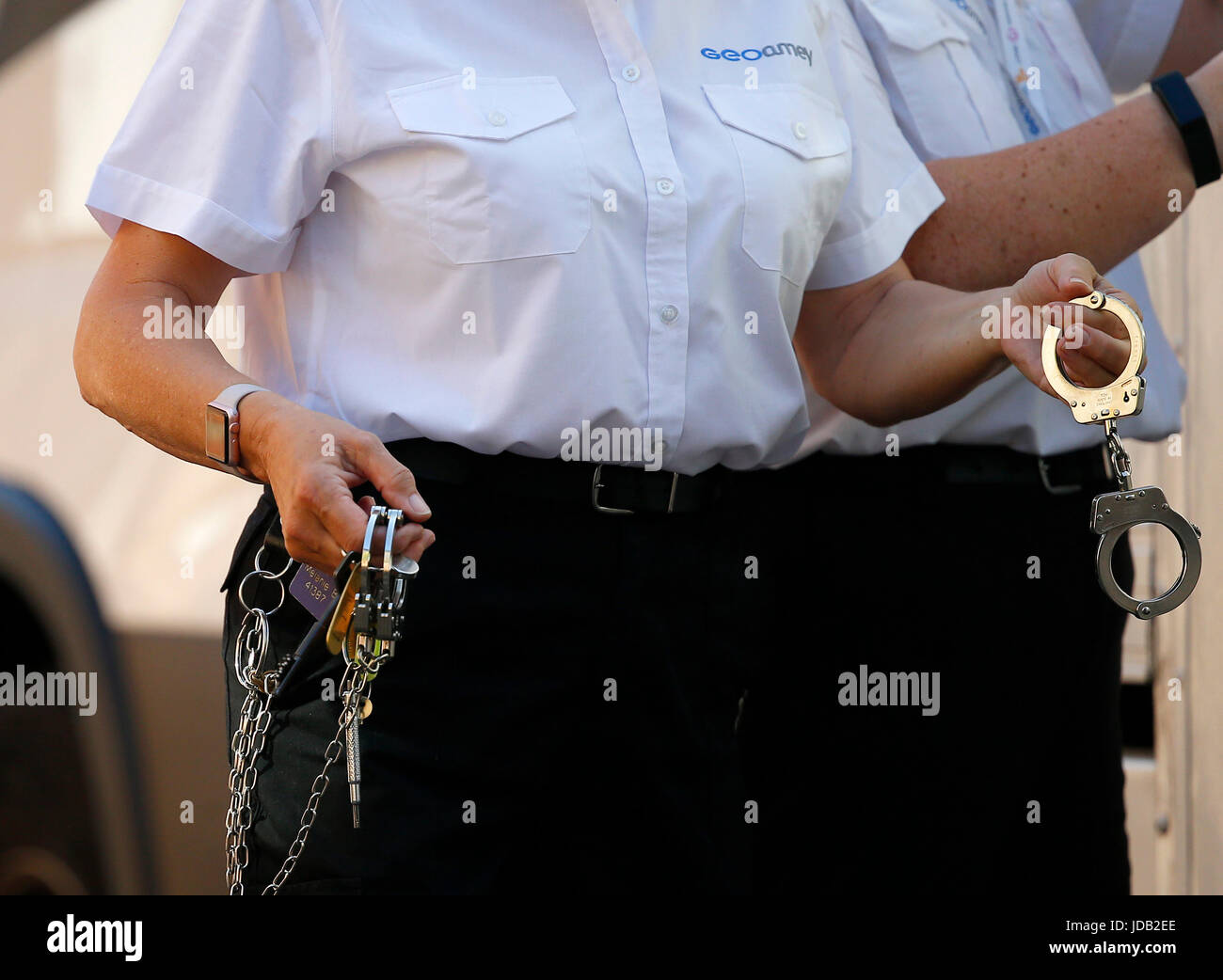 Prison officer in handcuffs hi-res stock photography and images - Alamy