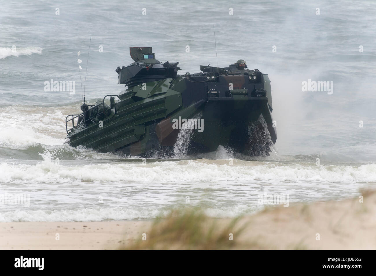 An American Assault Amphibious Vehicle AAV-7 is landing on the beach during the 45th edition of ...