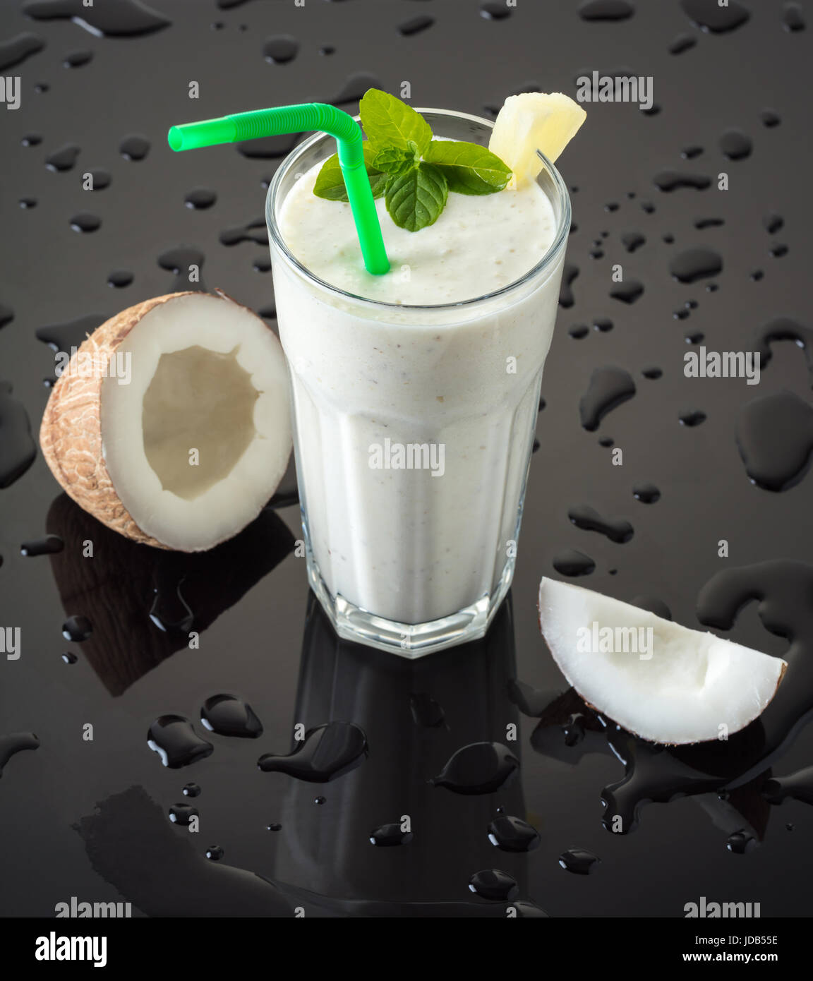 Milkshake with coconut on a black background with drops of water Stock ...