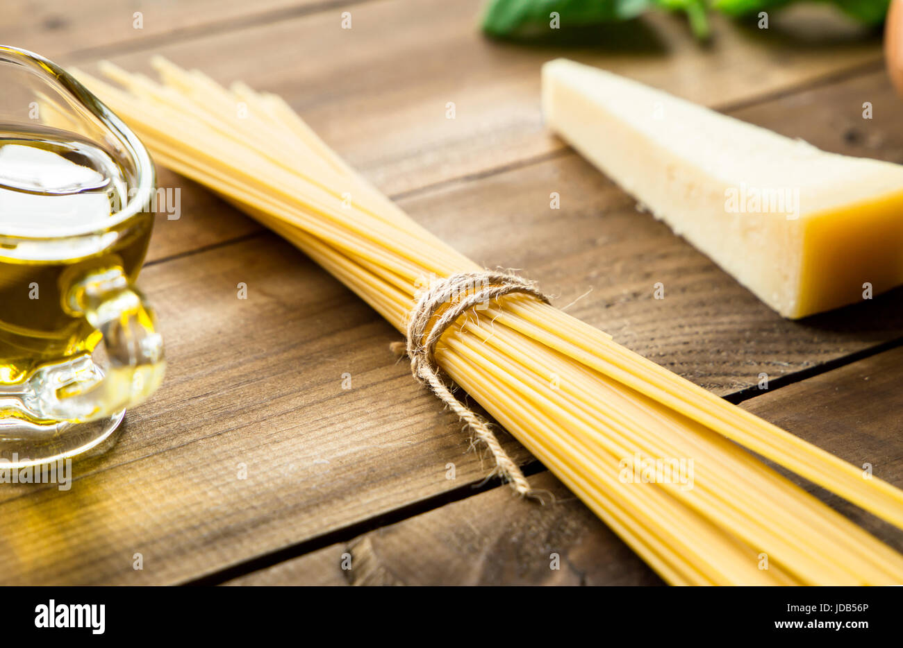 raw Spaghetti with parmesan cheese on a vintage wooden table Stock ...