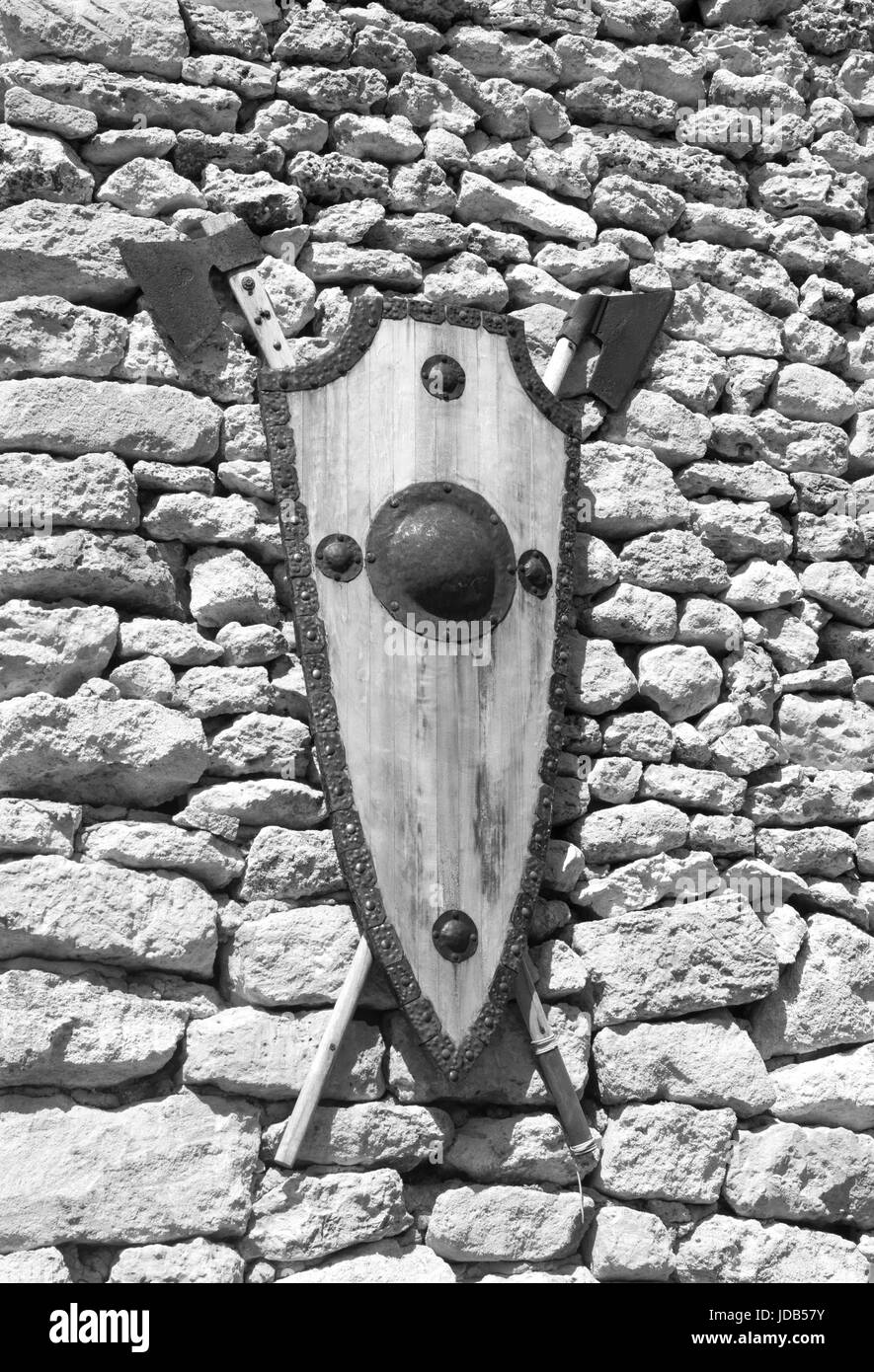 Old shield on a wall from stones Stock Photo - Alamy
