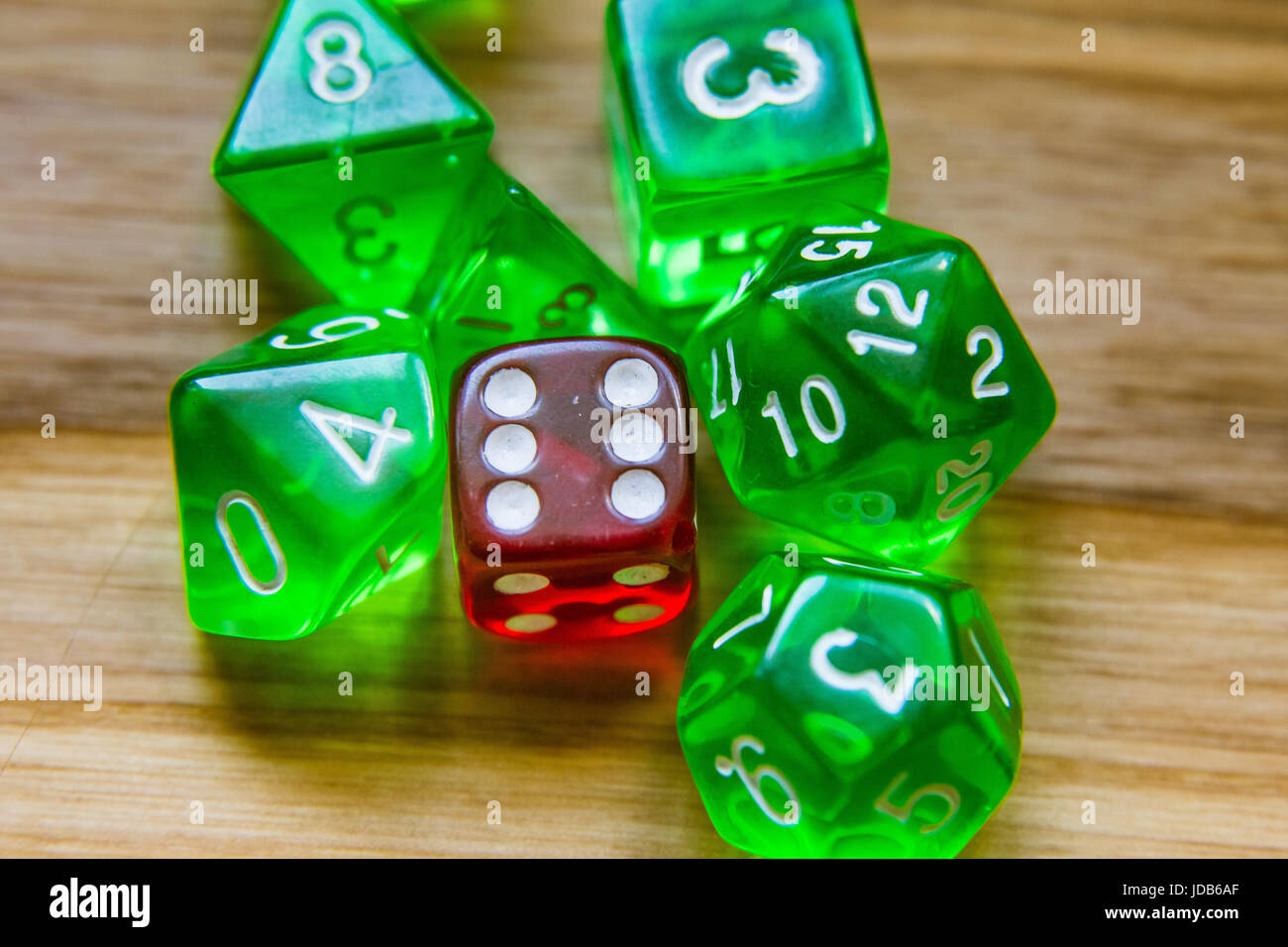A beautiful winning playing dice rolled on a side on wooden table Stock ...