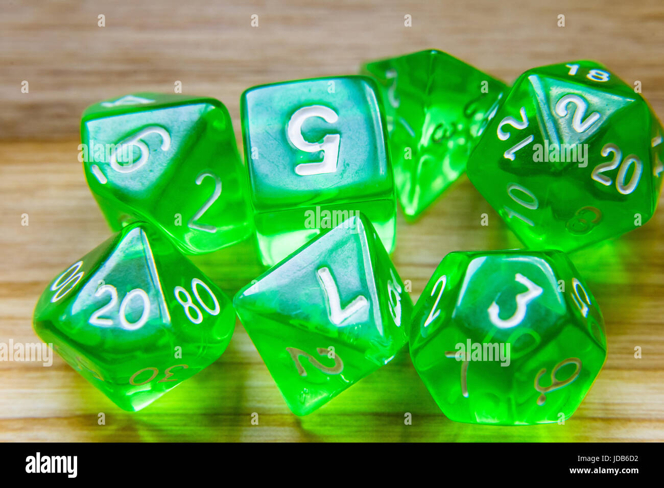 A beautiful winning playing dice rolled on a side on wooden table Stock ...