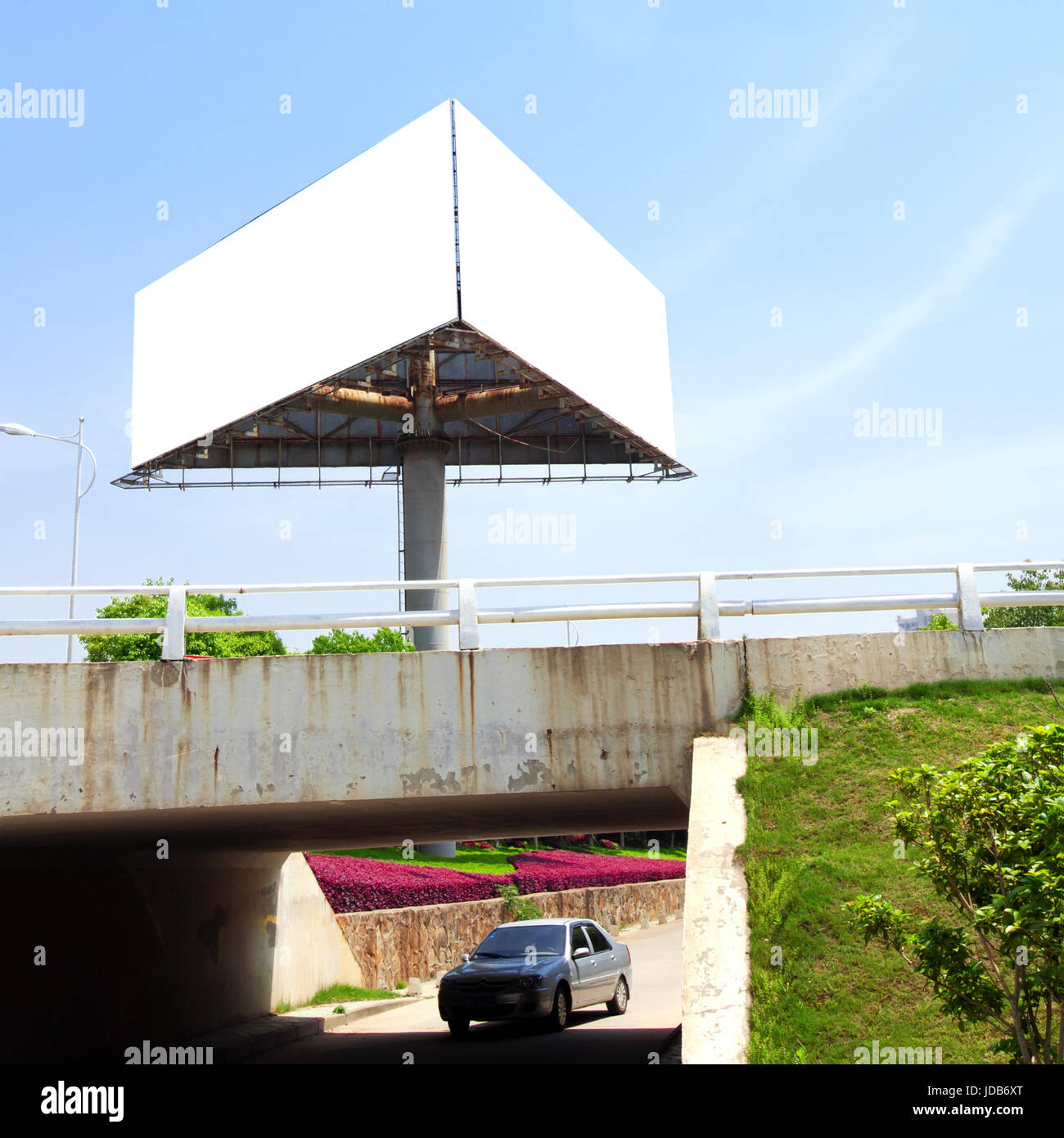 Overpass and billboards, the billboard stands next to the overpass ...