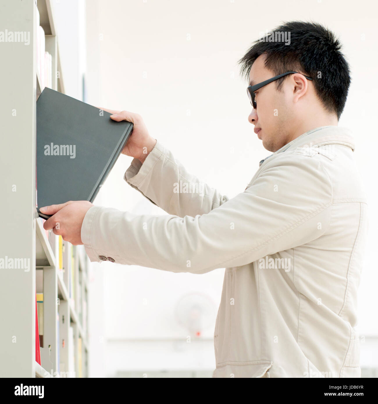 Handsome men in the selection of their favorite library books Stock ...