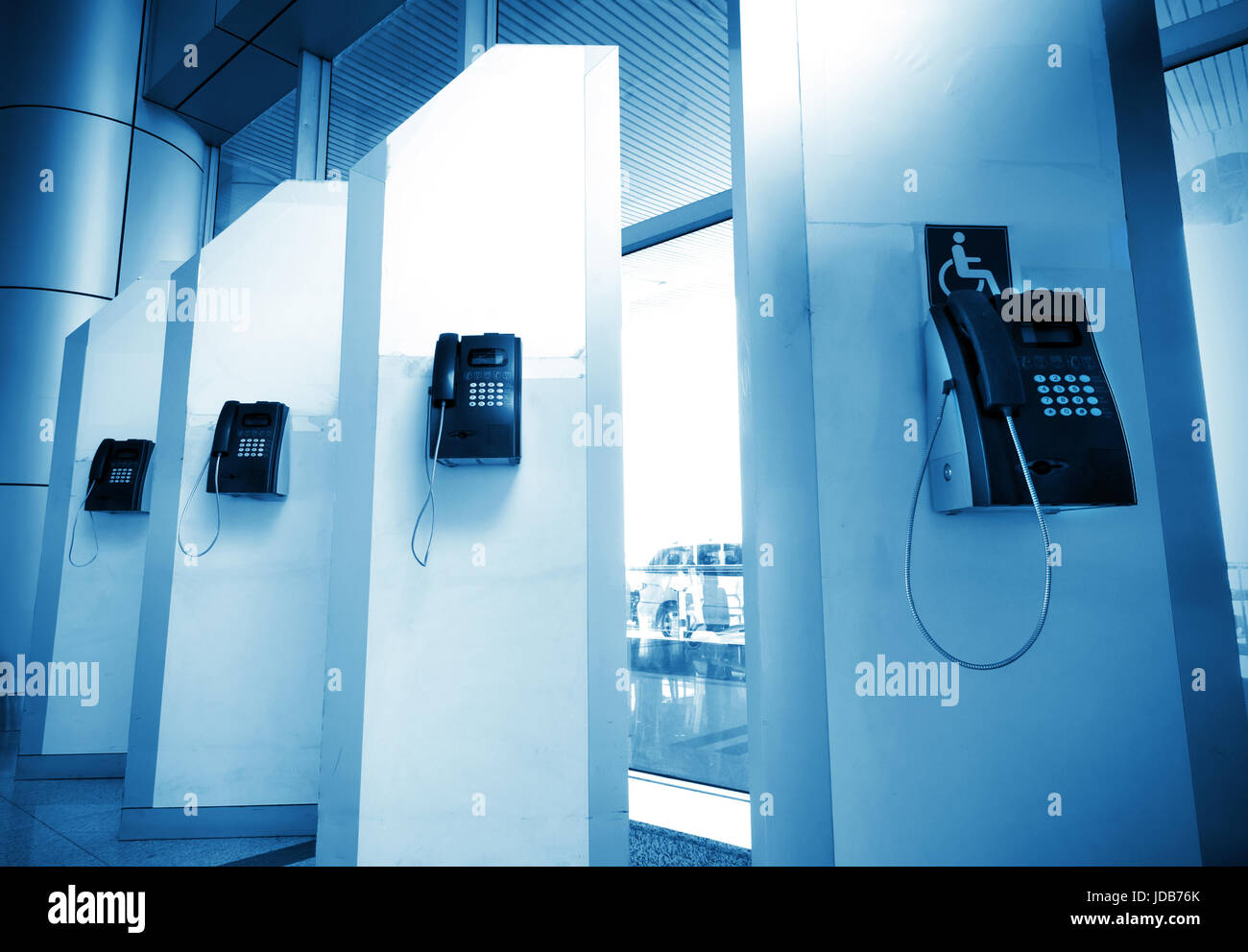 Terminal waiting hall, a row of public telephones Stock Photo - Alamy