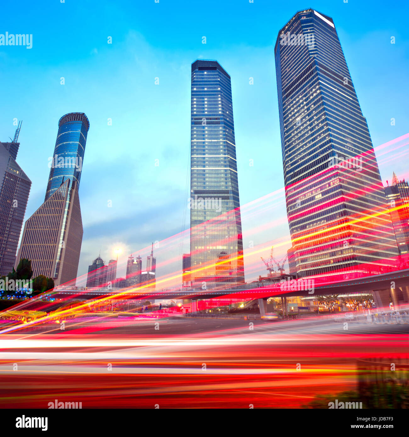 The light trails on the modern building background in shanghai china ...