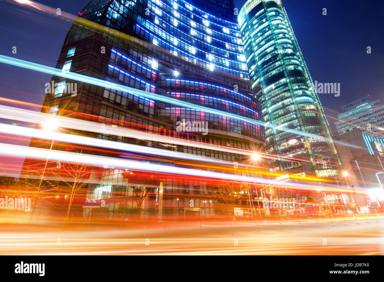 The light trails on the modern building background in shanghai china ...