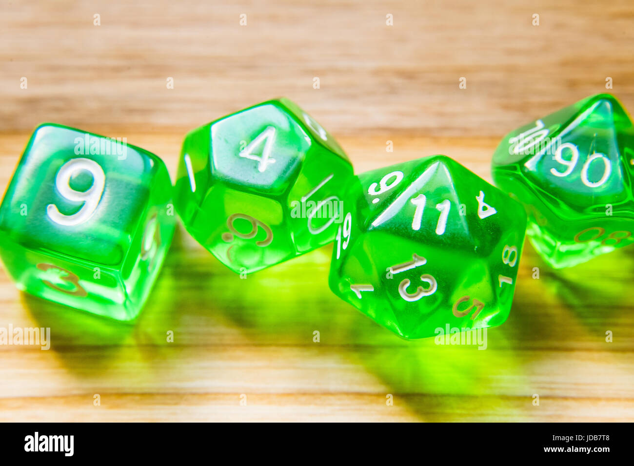 A beautiful winning playing dice rolled on a side on wooden table Stock ...