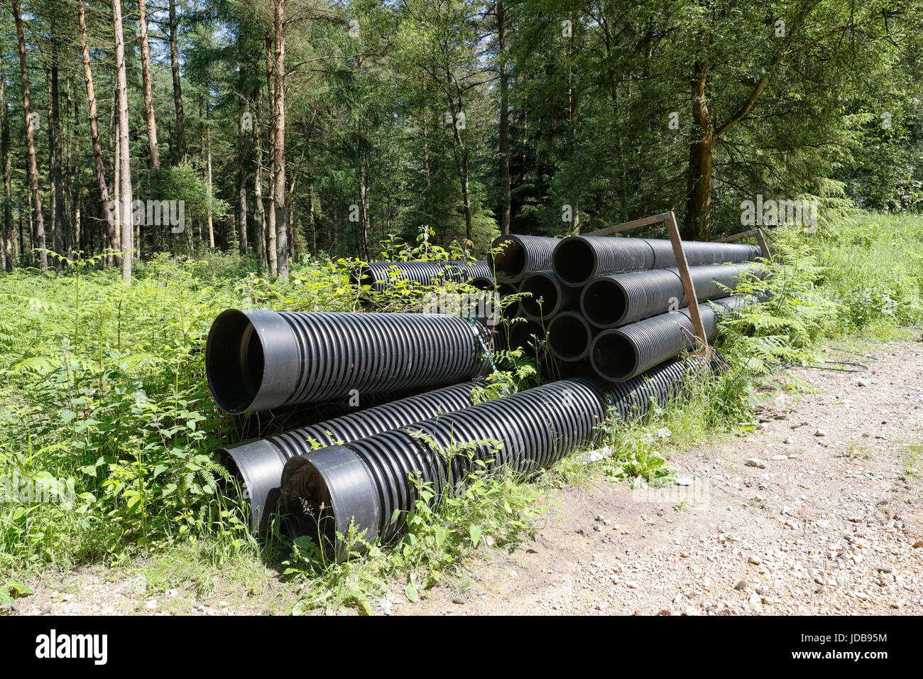 Polypropylene Land drainage pipes on a forest track to be used in the ...