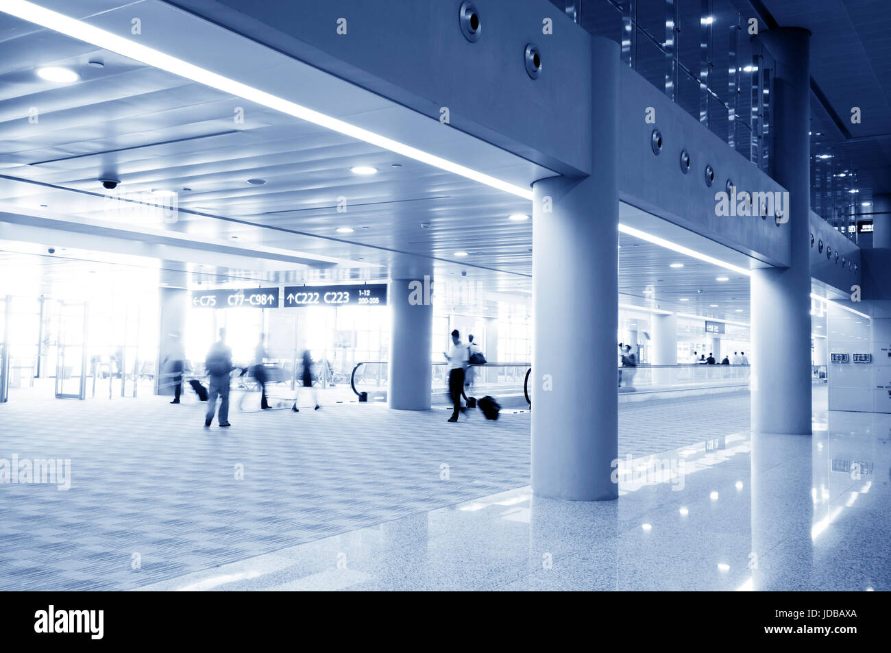 Clean tiled floor, reflection of light on floor and blurred view of ...