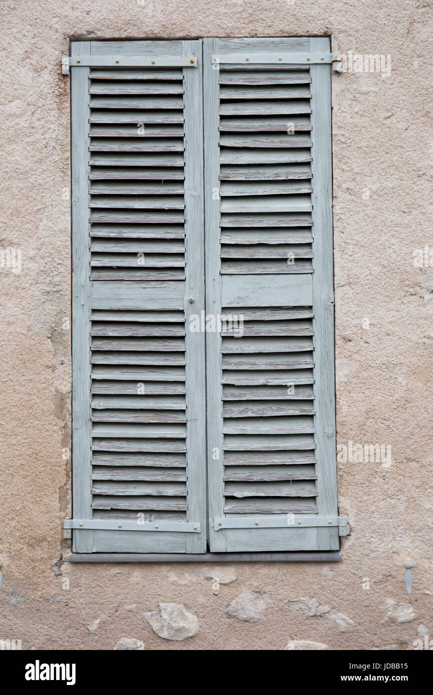 faded blue french shutters Stock Photo - Alamy