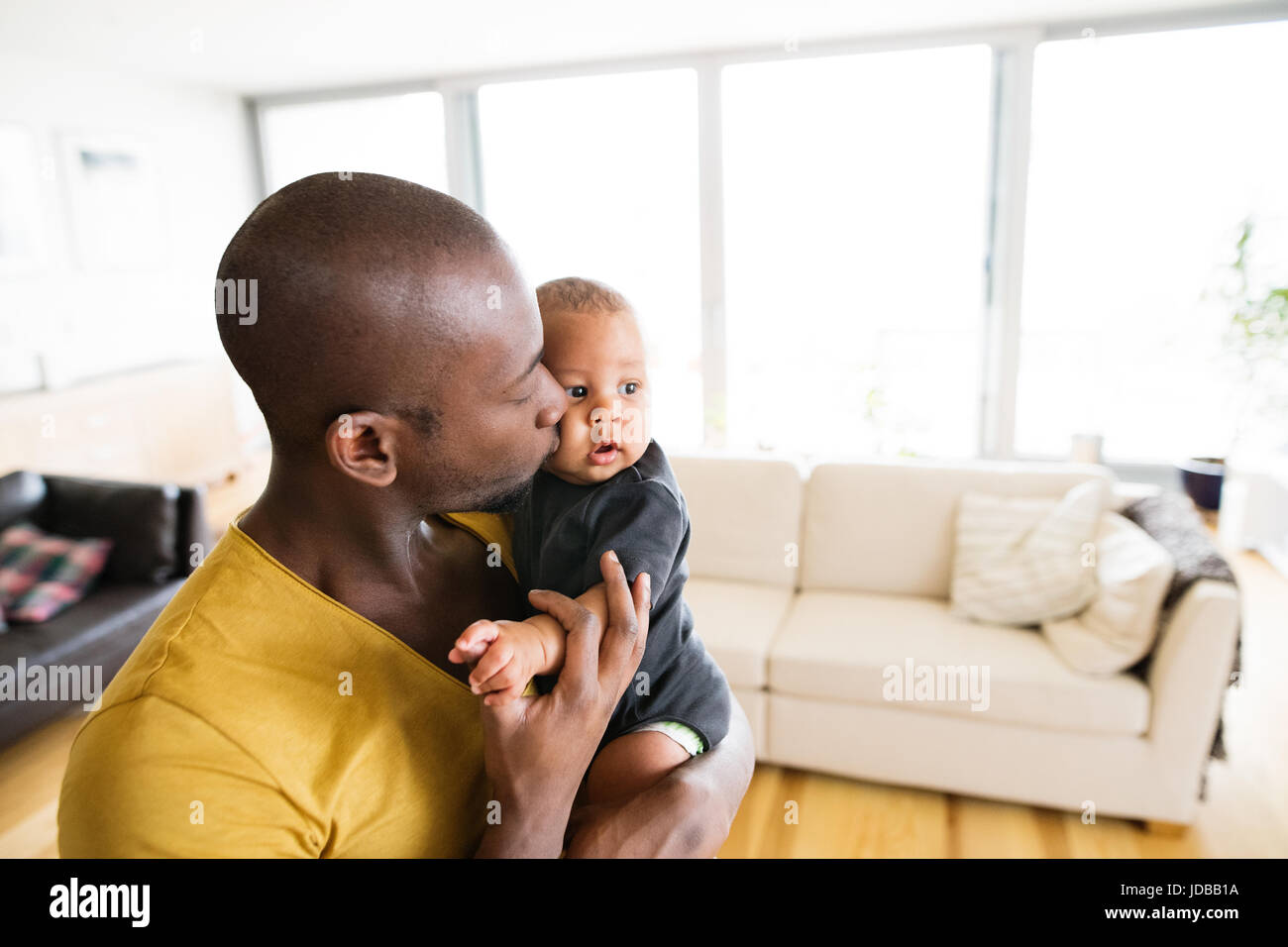 African american holding baby family hi-res stock photography and ...