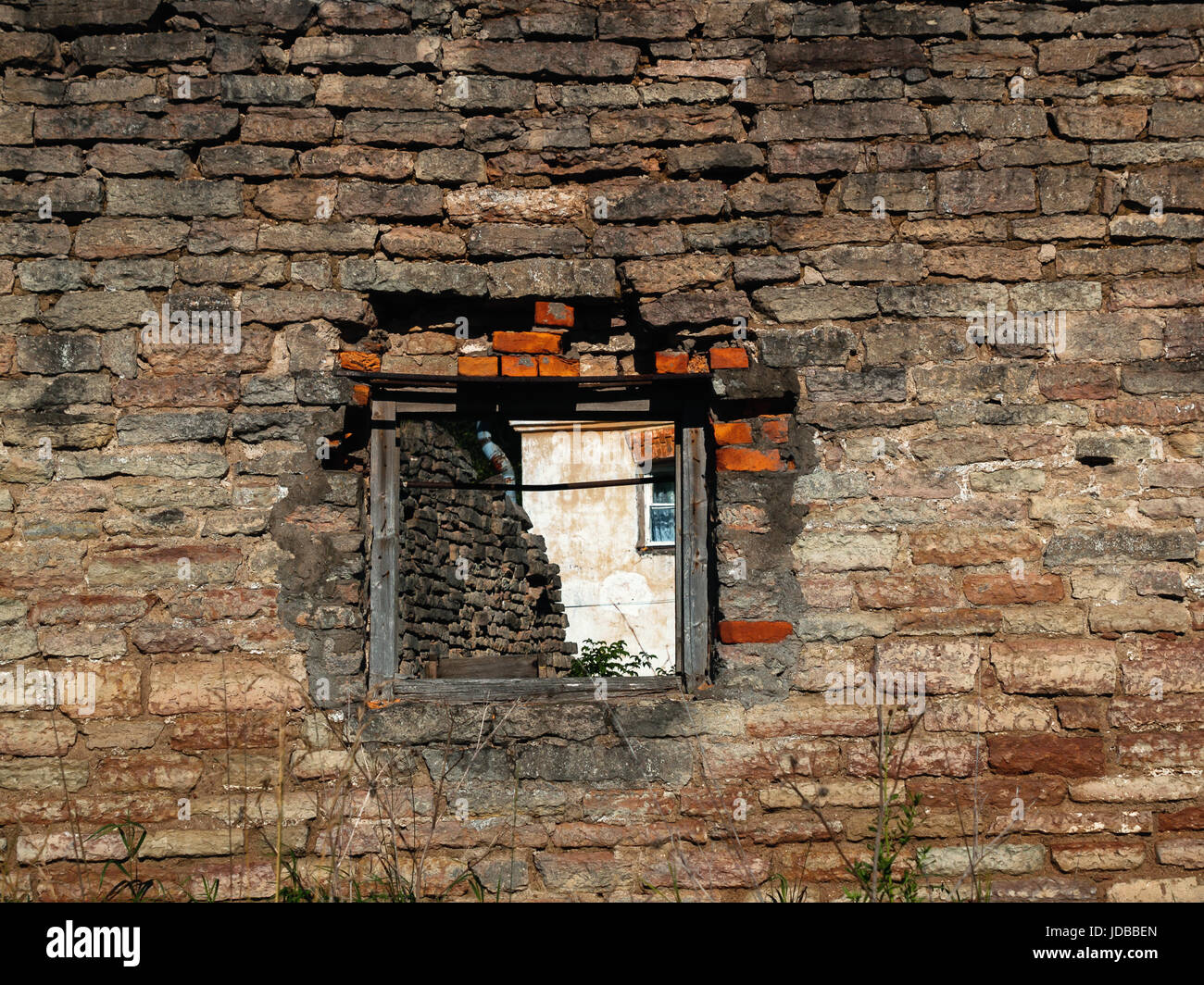 Brick wall of the old destroyed house with textured bricks with an ...