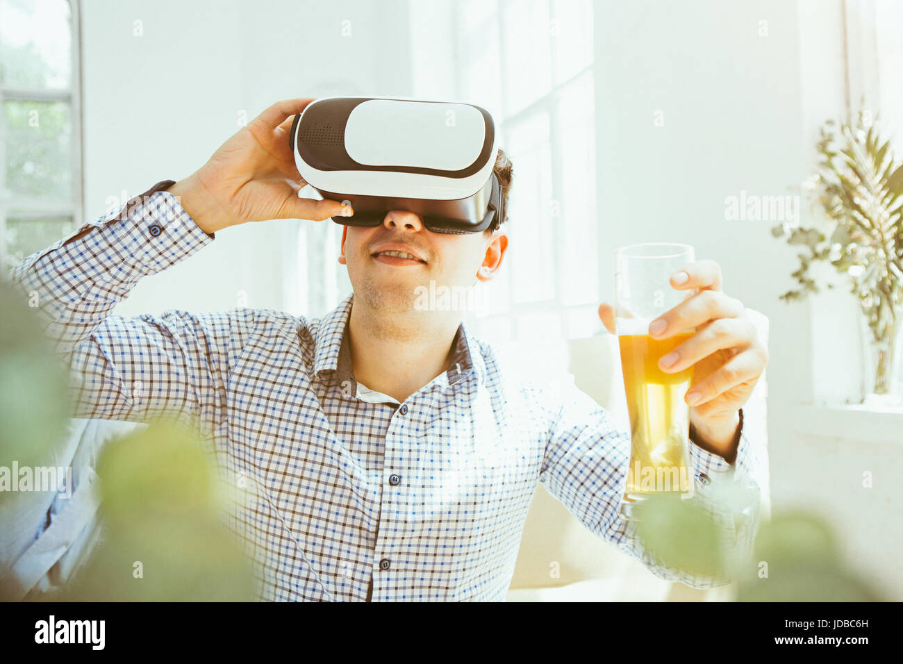 The man with glasses of virtual reality at home. Future technology ...