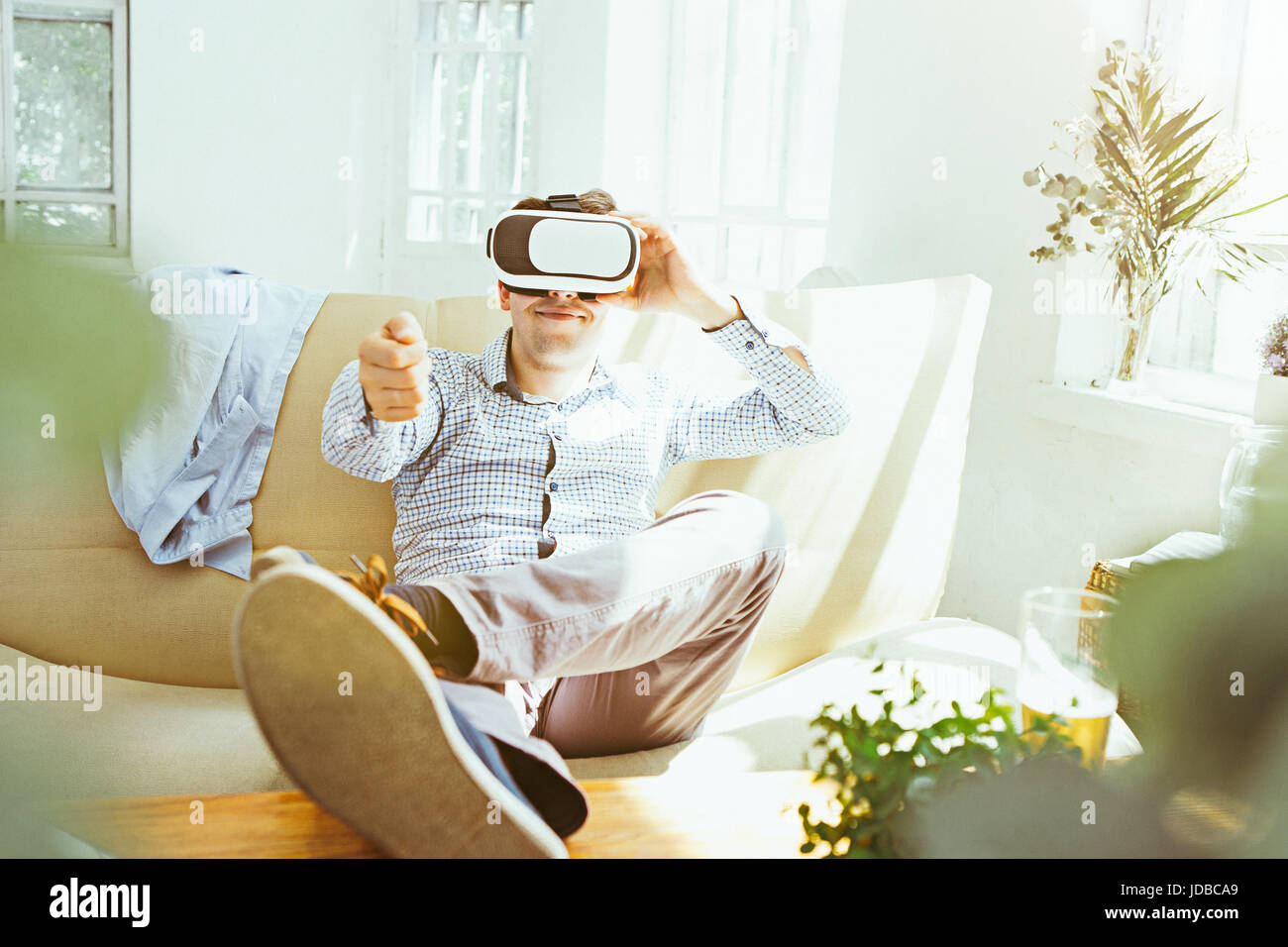 The man with glasses of virtual reality at home. Future technology ...