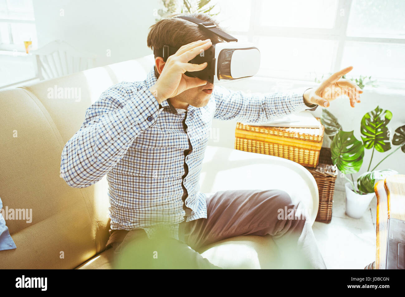 The man with glasses of virtual reality at home. Future technology ...