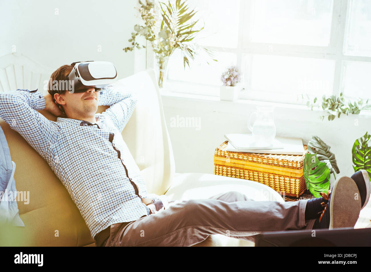 The man with glasses of virtual reality at home. Future technology ...