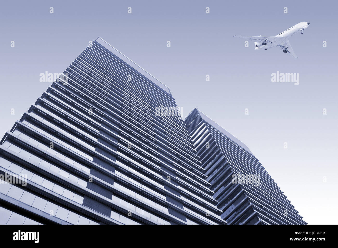 Airplane over the city，High-rise buildings Stock Photo - Alamy