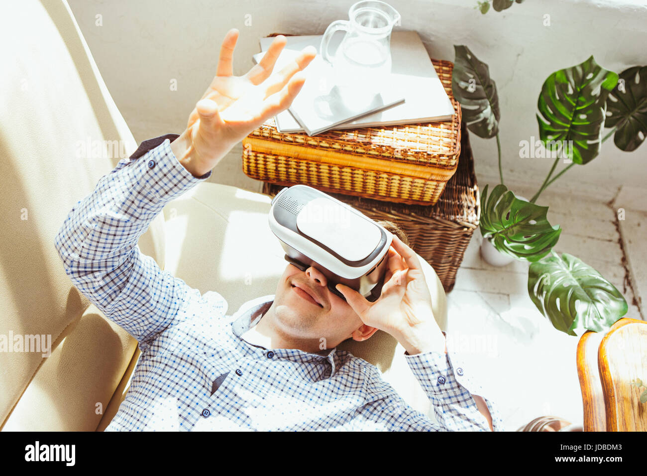 The man with glasses of virtual reality at home. Future technology ...