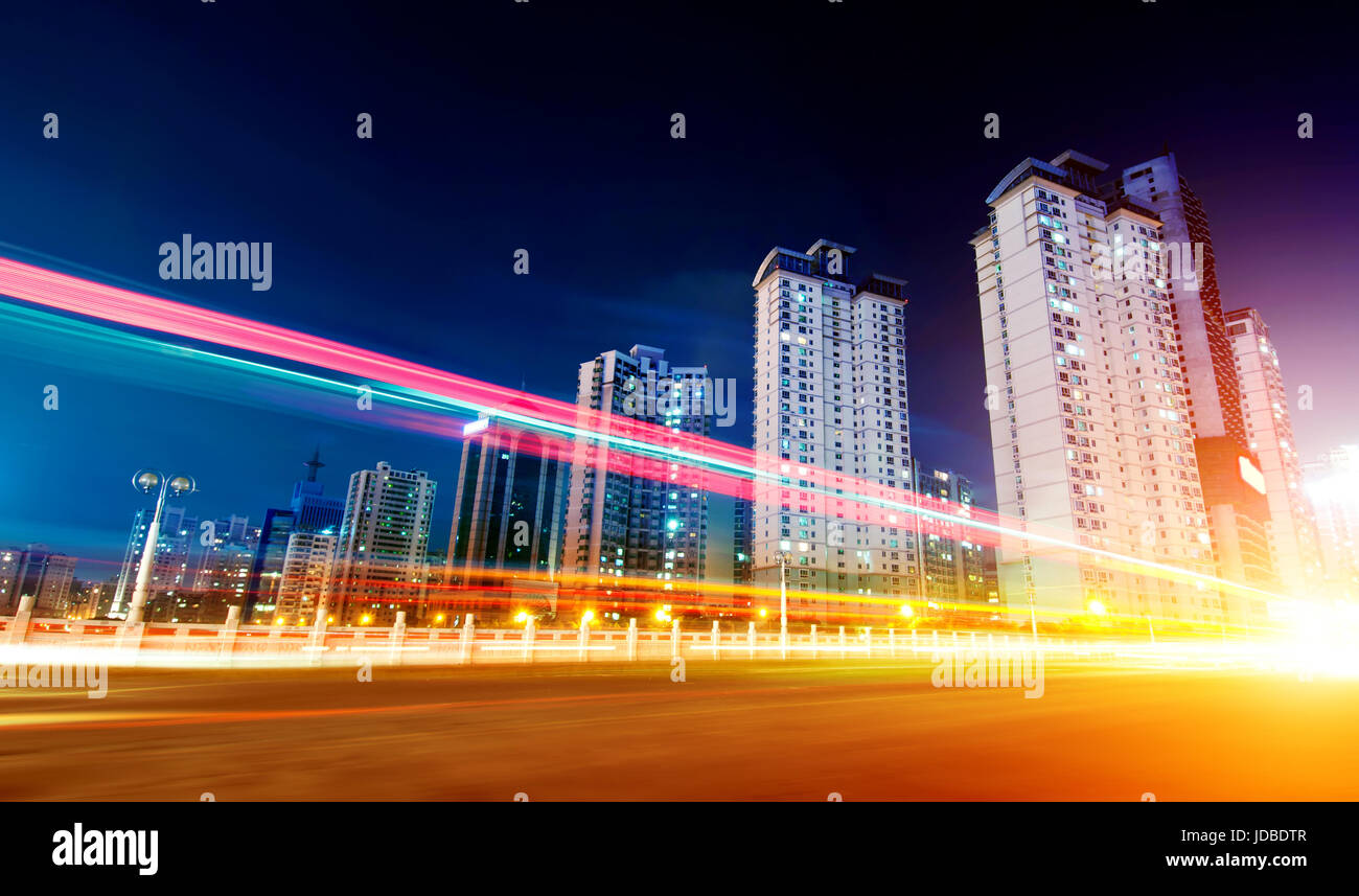 The light trails on the modern building background in shanghai china ...