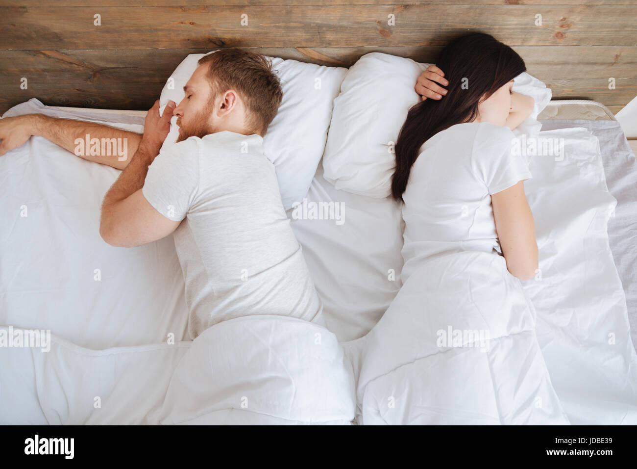 Young lovers sleeping in bed hi-res stock photography and images - Alamy