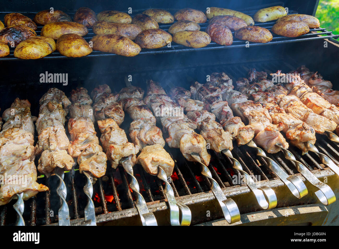 Roasted meat barbecue on the grill. Caucasian dish skewers. Perspective ...