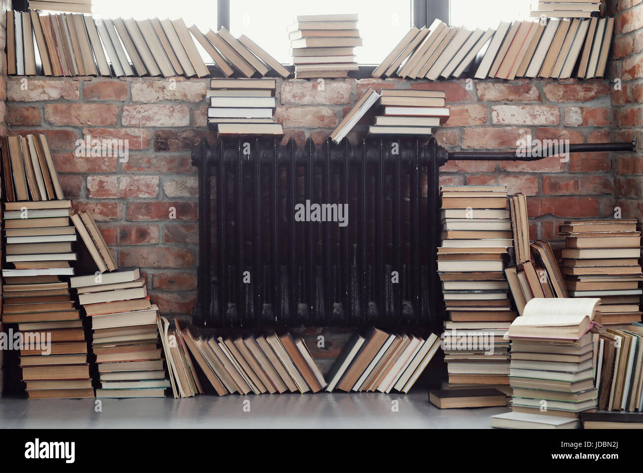 Library. Pile of books indoor Stock Photo - Alamy