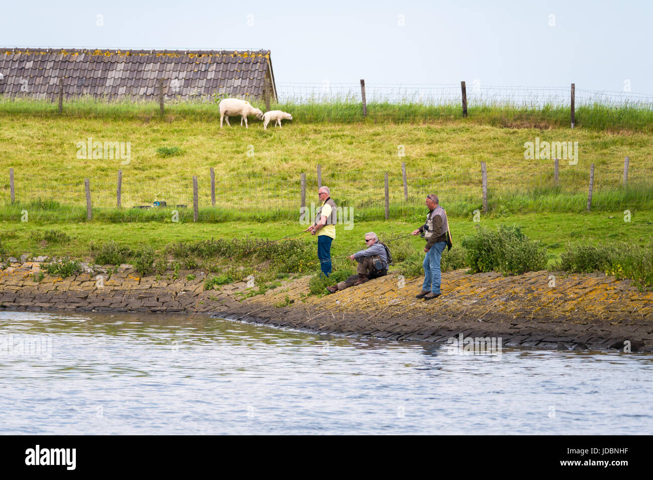 Three people fishing hi-res stock photography and images - Alamy