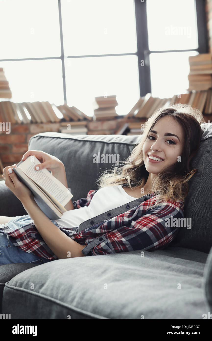 Education and books. Lovely woman in the library Stock Photo - Alamy