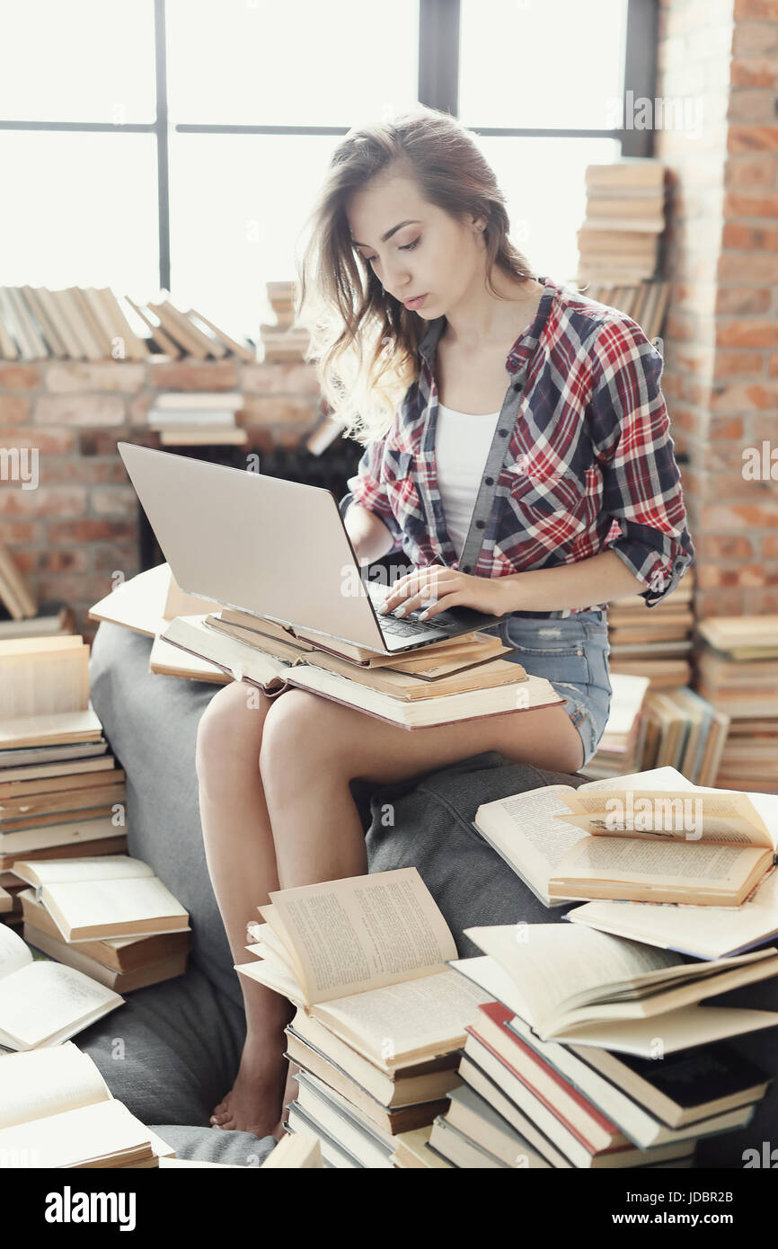 Education and books. Lovely woman in the library Stock Photo - Alamy