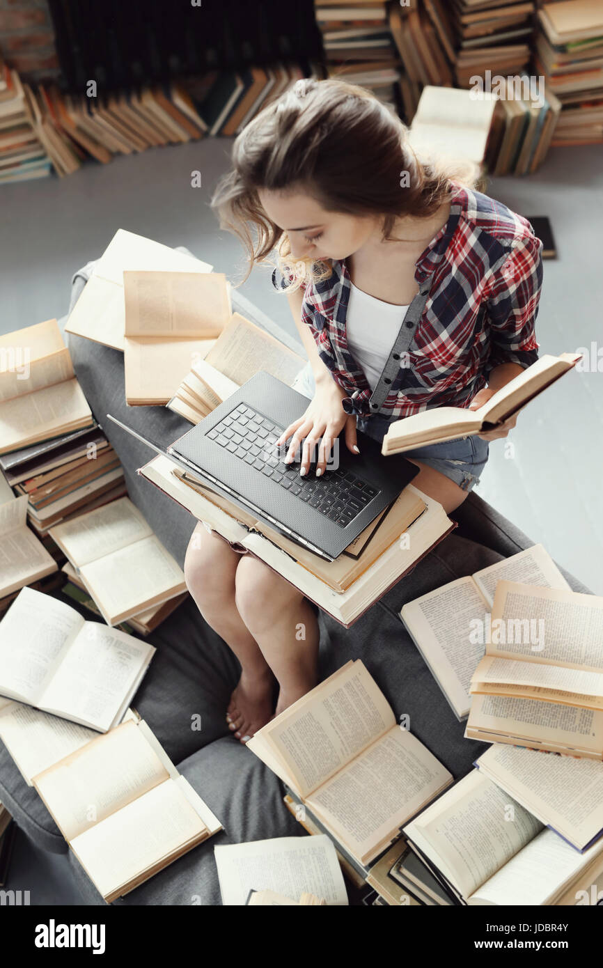 Education and books. Lovely woman in the library Stock Photo - Alamy
