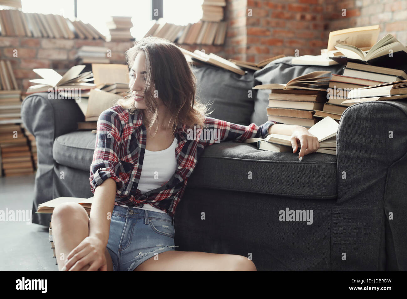 Education and books. Lovely woman in the library Stock Photo - Alamy