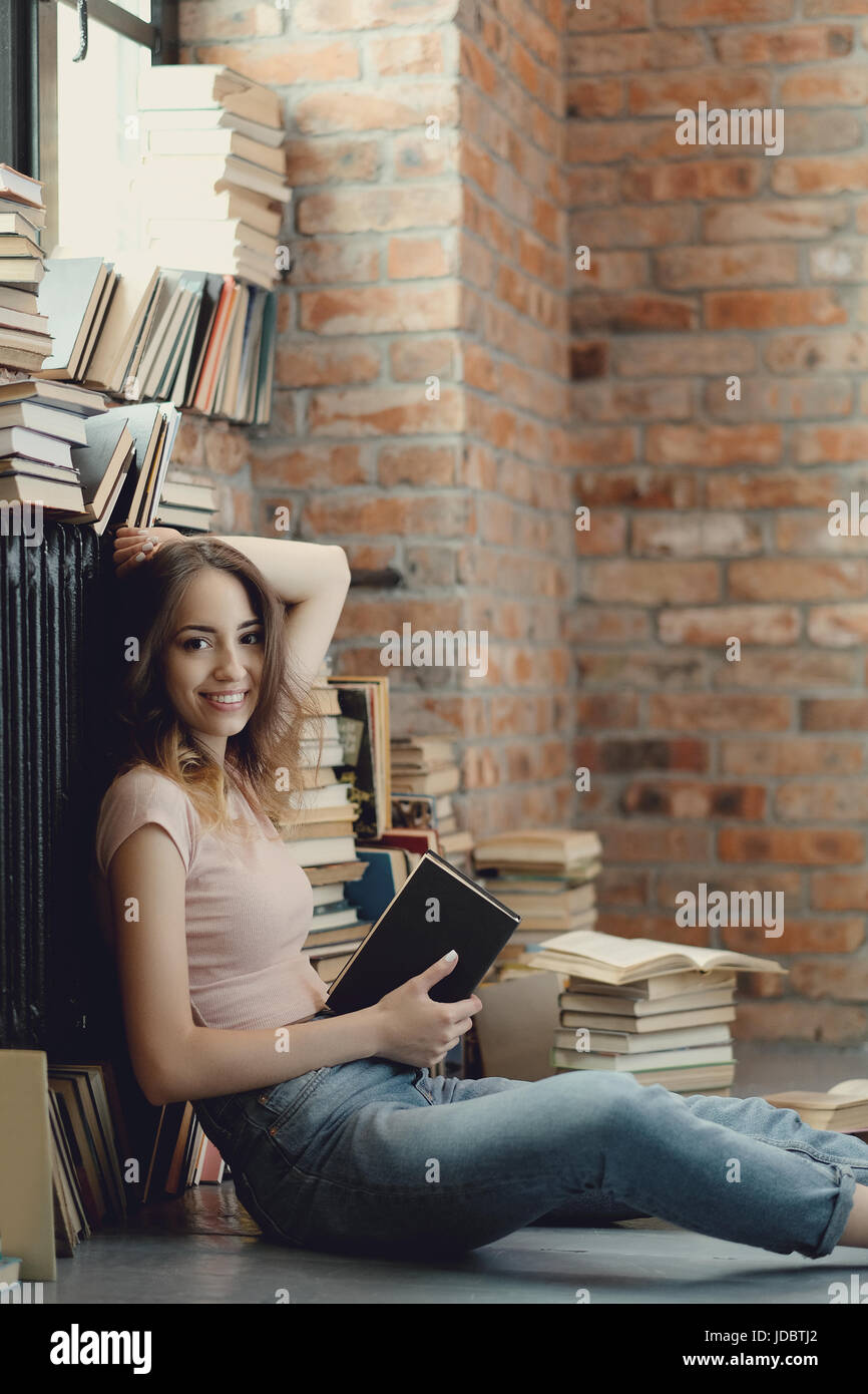 Education and books. Lovely woman in the library Stock Photo - Alamy