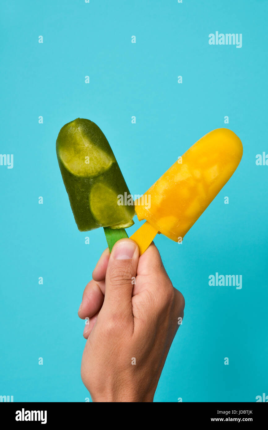 closeup of a young caucasian man with two different homemade natural ...