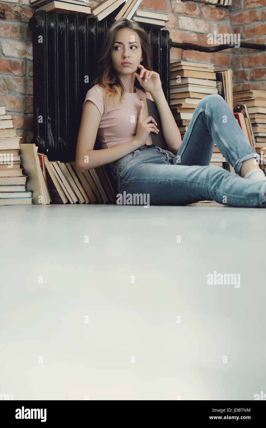 Education and books. Lovely woman in the library Stock Photo - Alamy