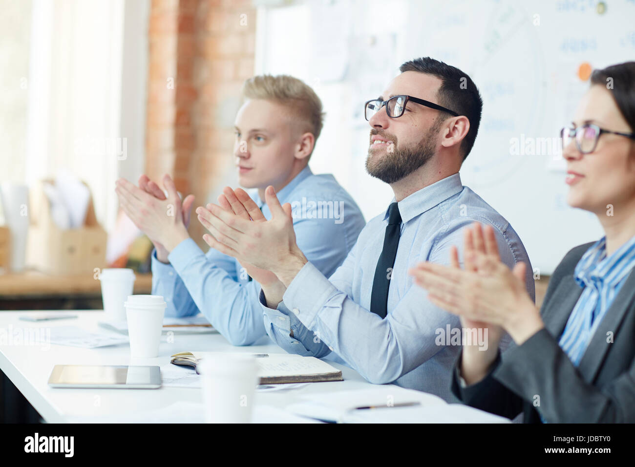 Business people clapping after presentation hi-res stock photography ...