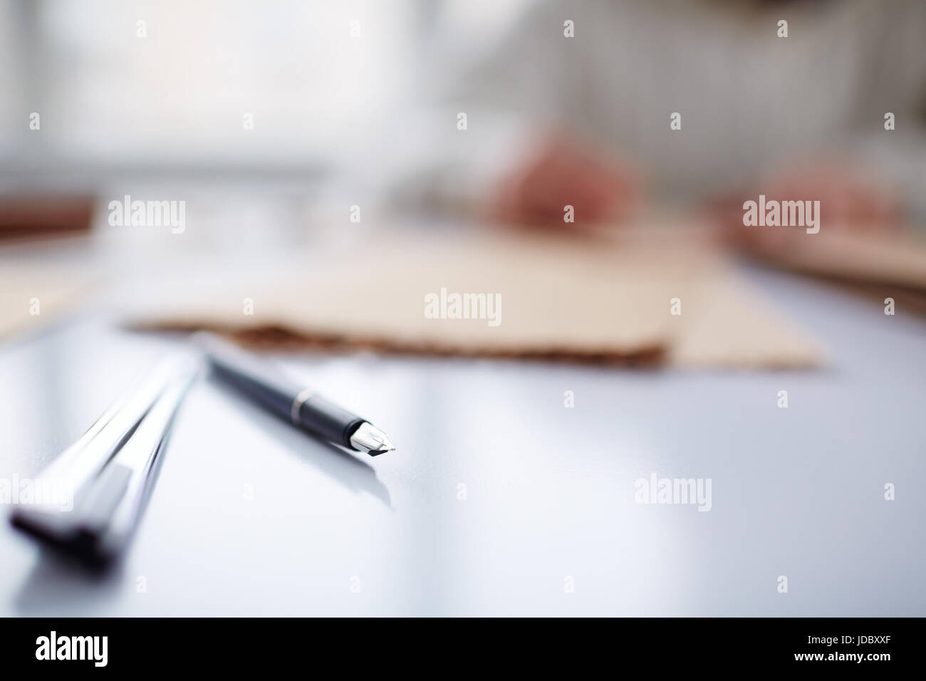 Pen on table Stock Photo - Alamy