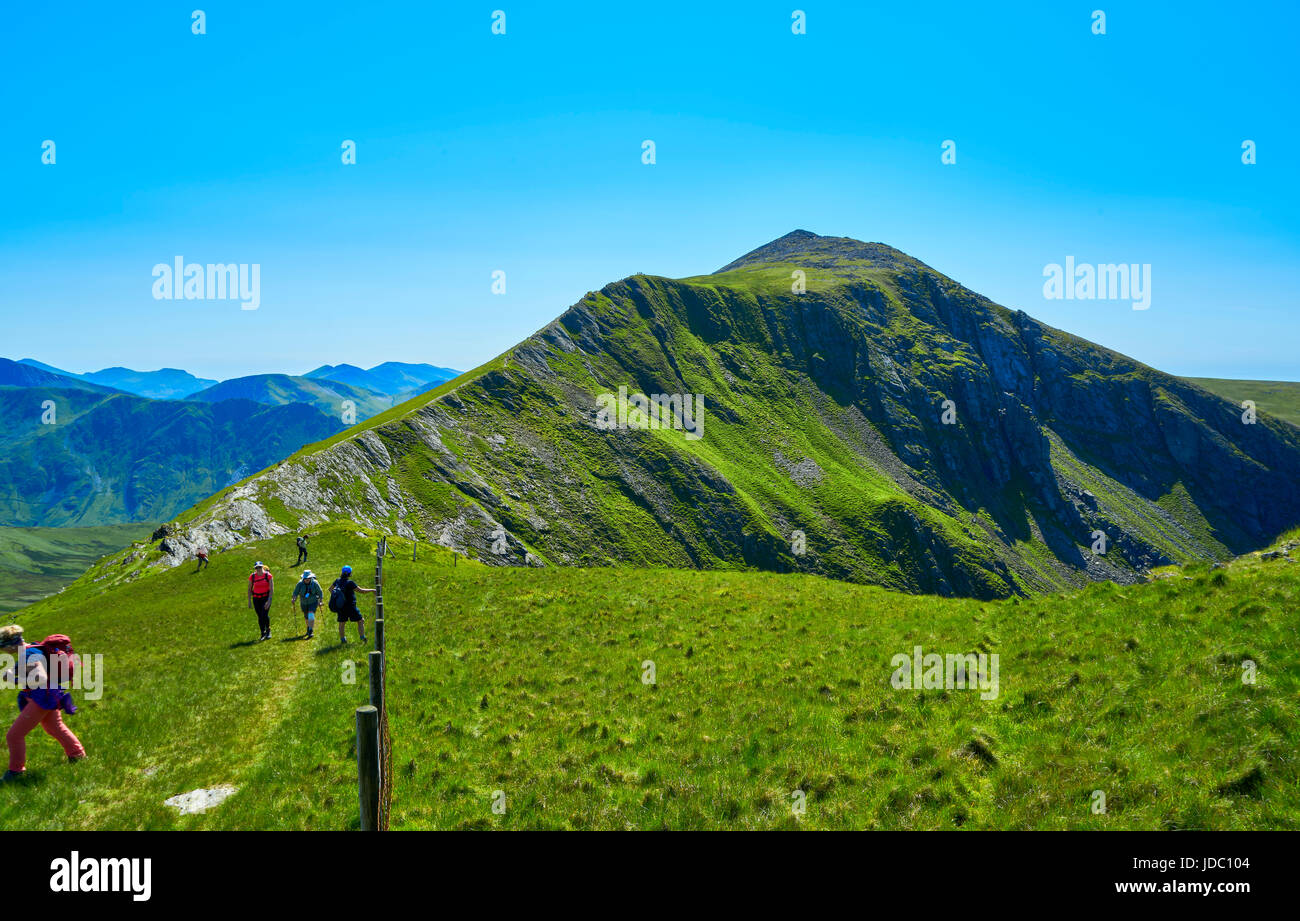 A group of female hikers with views towards Snowdon in Snowdonia ...