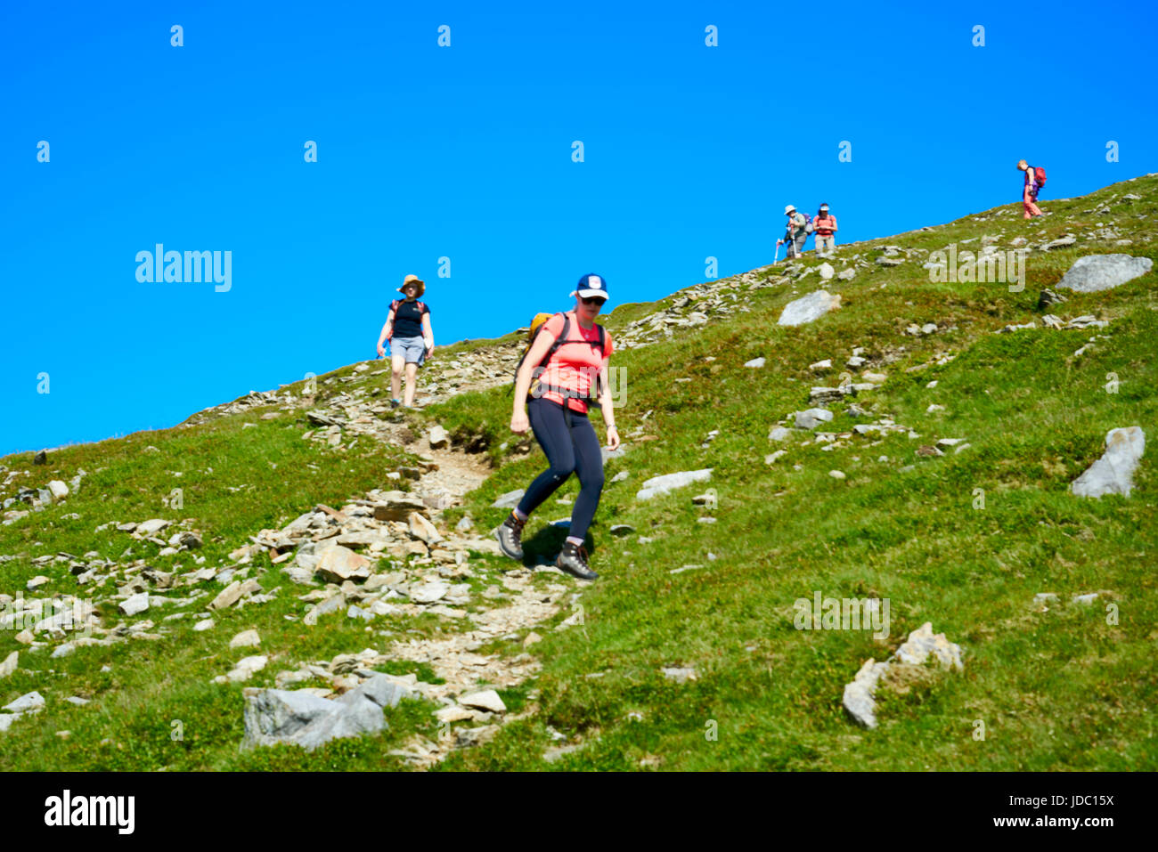 A group of female walkers descending a mountain in Snowdonia, Wales, UK ...